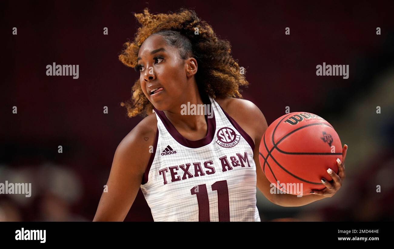 Texas A&M guard Kayla Wells (11) looks to pass again Oklahoma Baptist ...