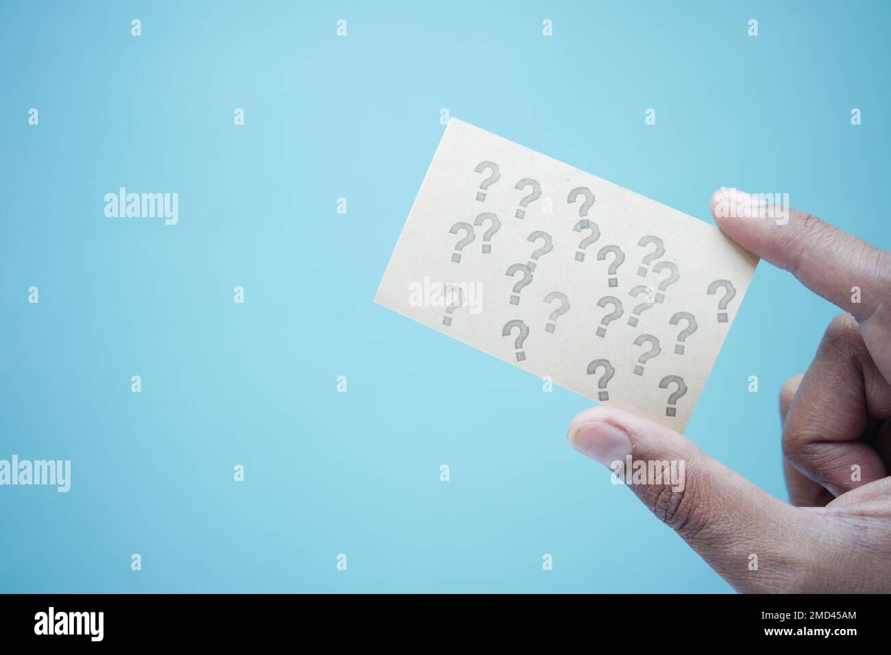 holding a paper with question mark Stock Photo - Alamy
