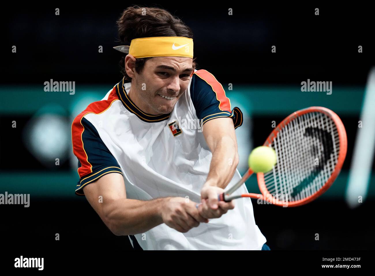Taylor Fritz, of the United States, plays a return to Cameron Norrie of ...