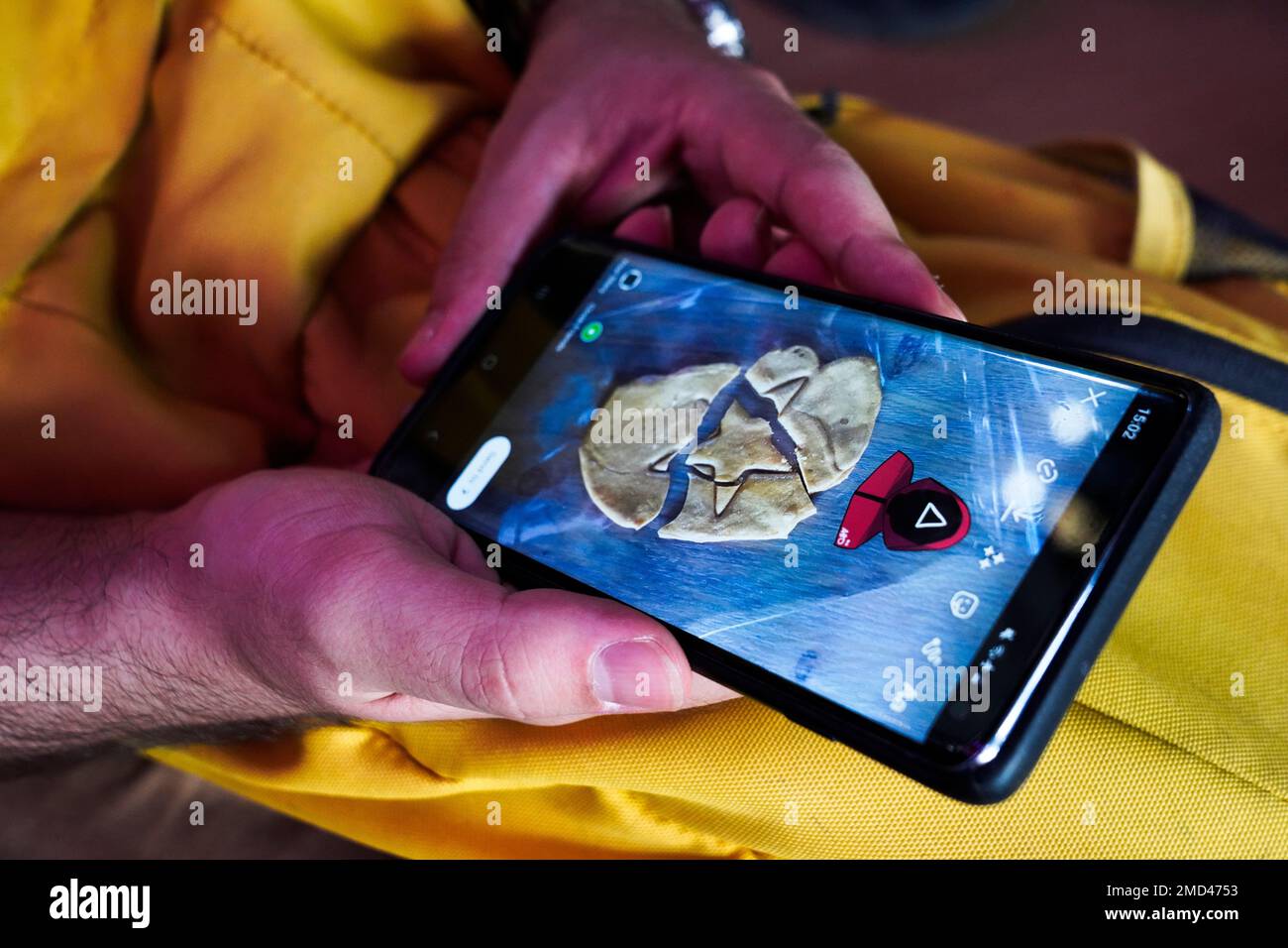 Ehsan Ahani of Tehran, Iran, prepares a photograph on his mobile phone ...