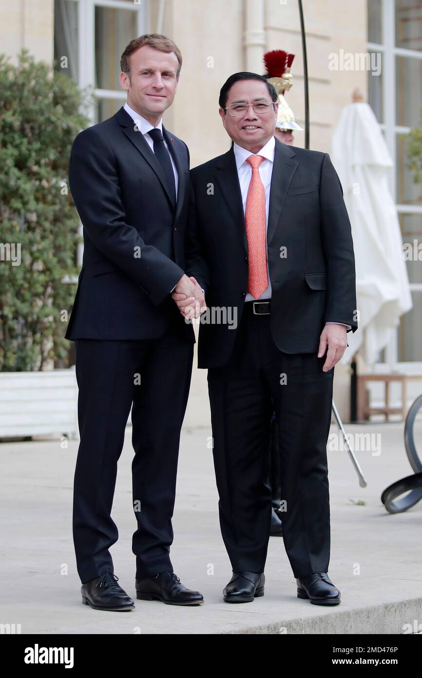 French President Emmanuel Macron, left, welcomes Chinh Minh Pham, Prime ...