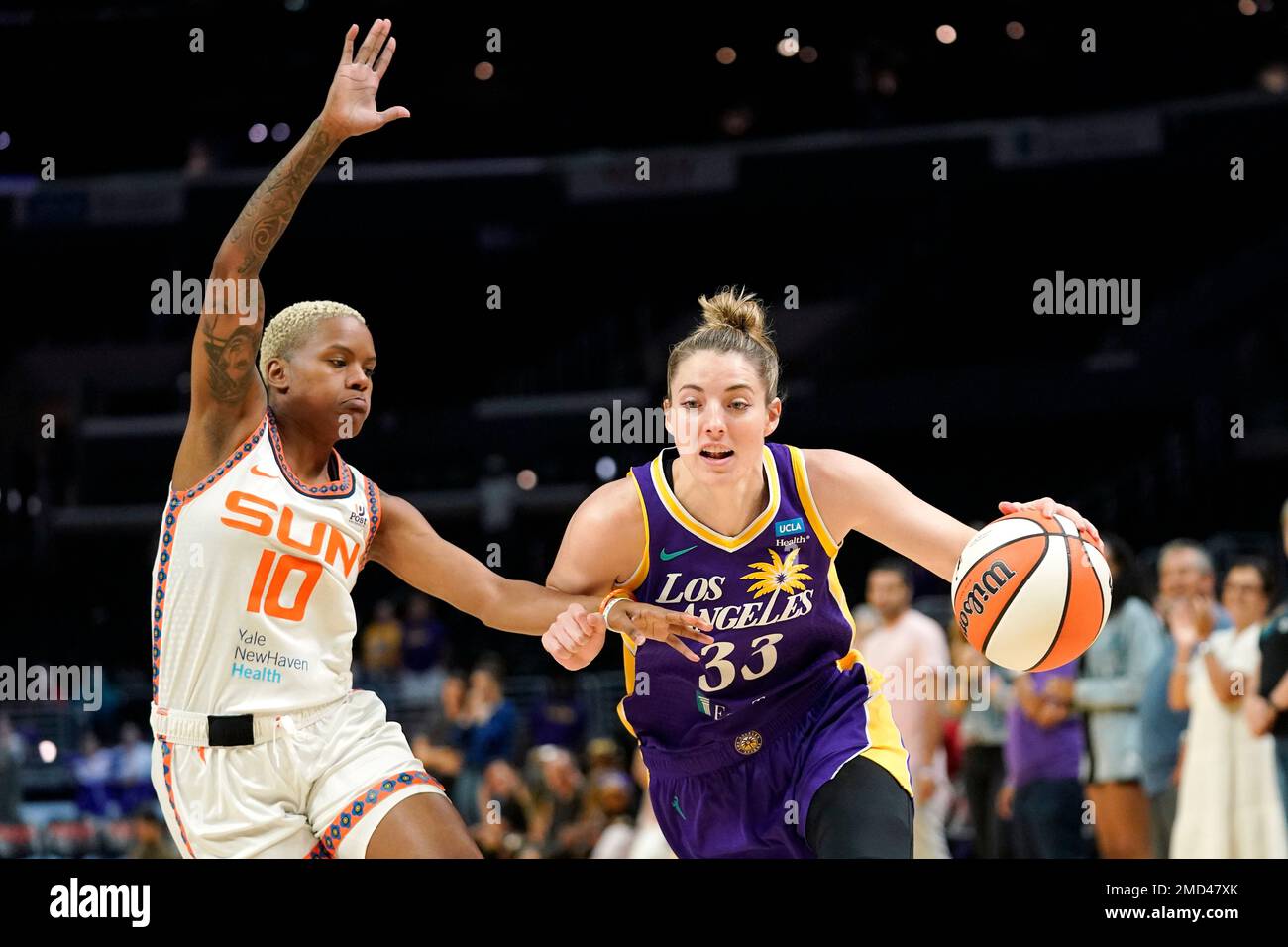 FILE - Los Angeles Sparks forward Katie Lou Samuelson, right, drives ...