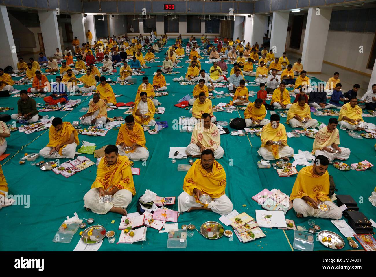 Traders perform rituals during Chopada Pujan, a mass prayer ceremony ...
