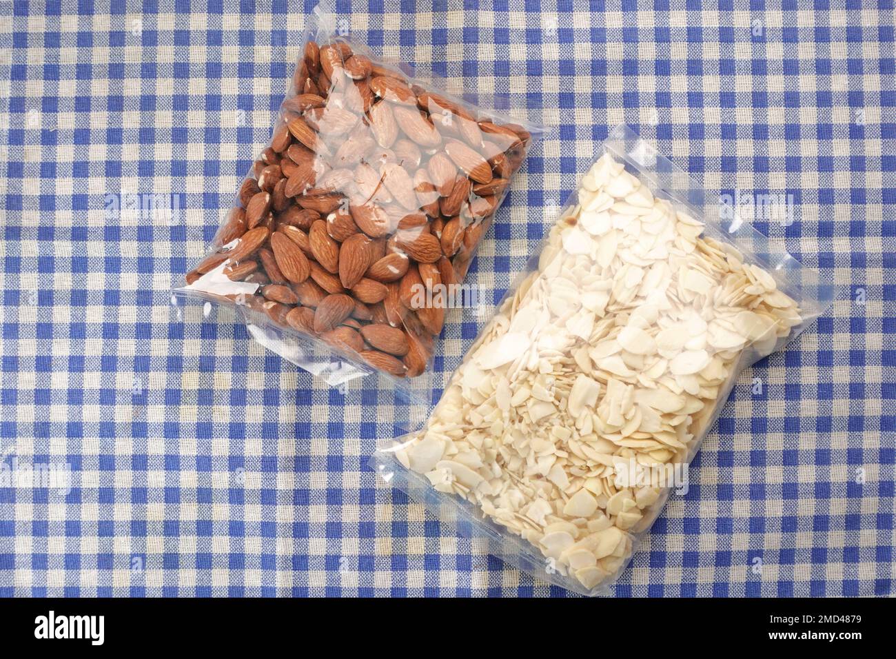 top view of almond nuts in a plastic packet on table Stock Photo - Alamy