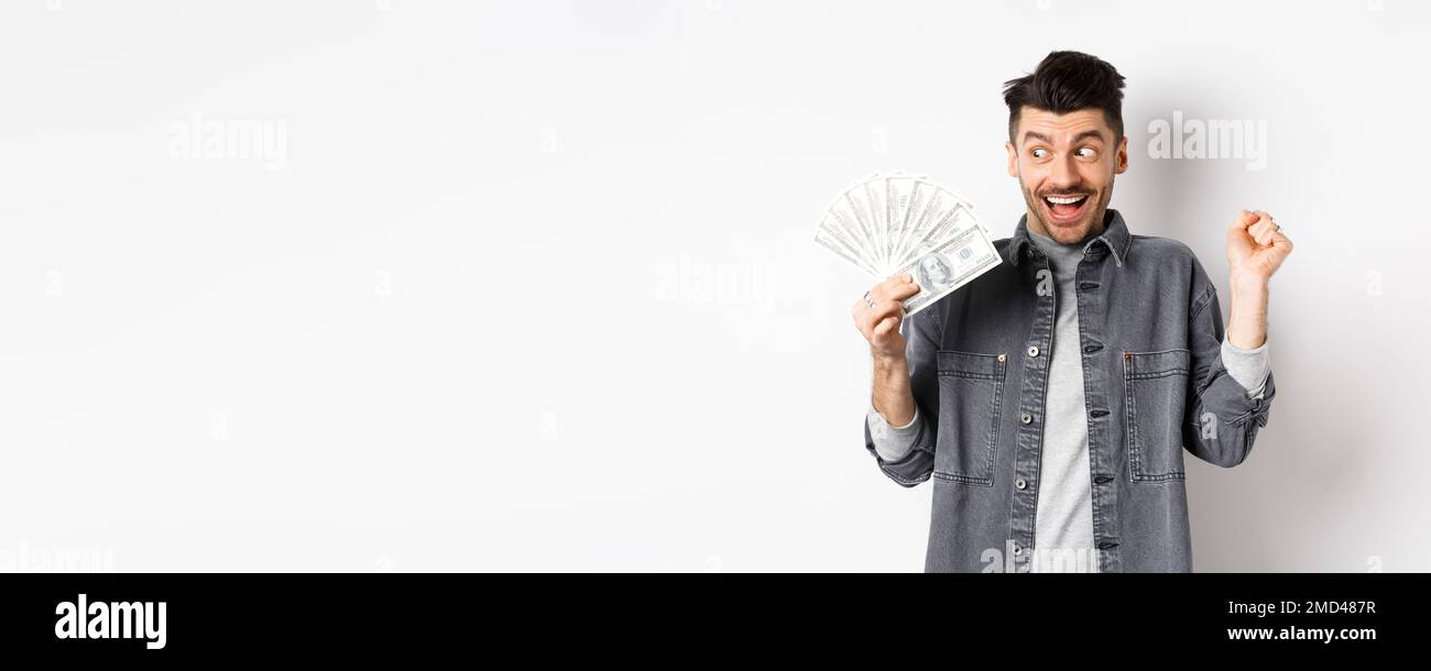 Lucky man winning prize money and scream of excitement, staring at ...