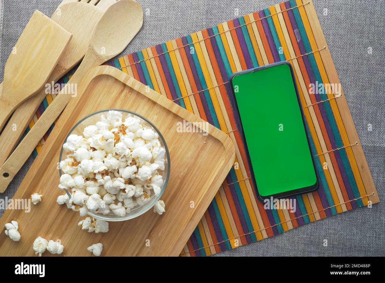 top view of smart phone and popcorn on table Stock Photo - Alamy
