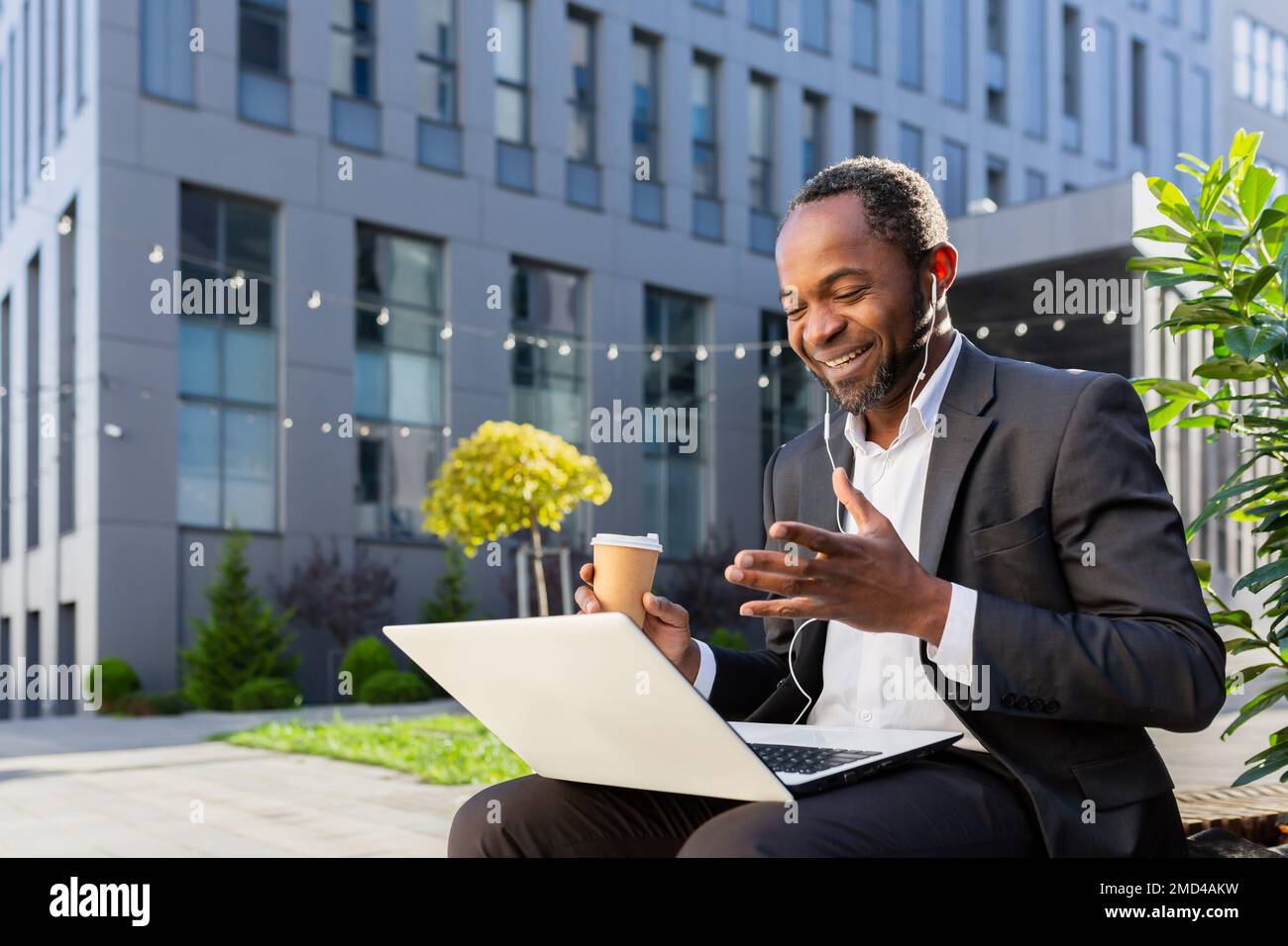 African american businessman outside office building talking to ...