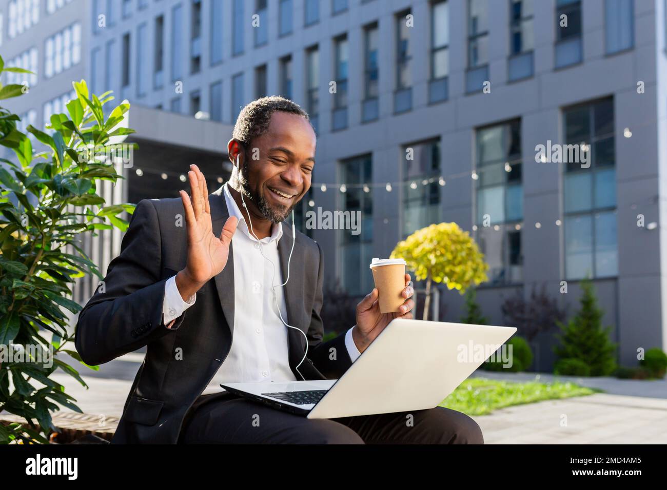 African american businessman outside office building talking to ...