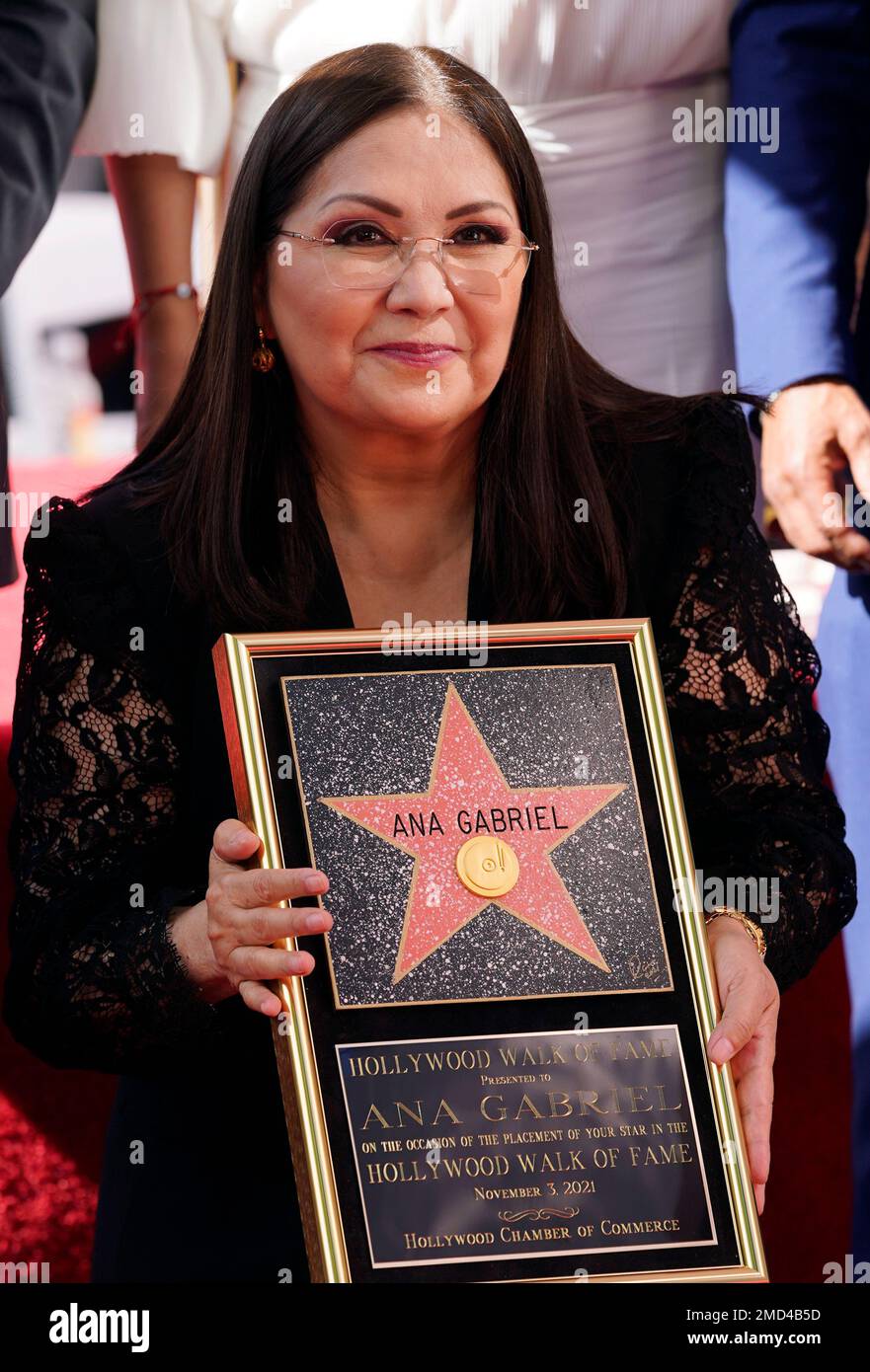 Mexican singer Ana Gabriel poses with a replica of her new star on the ...
