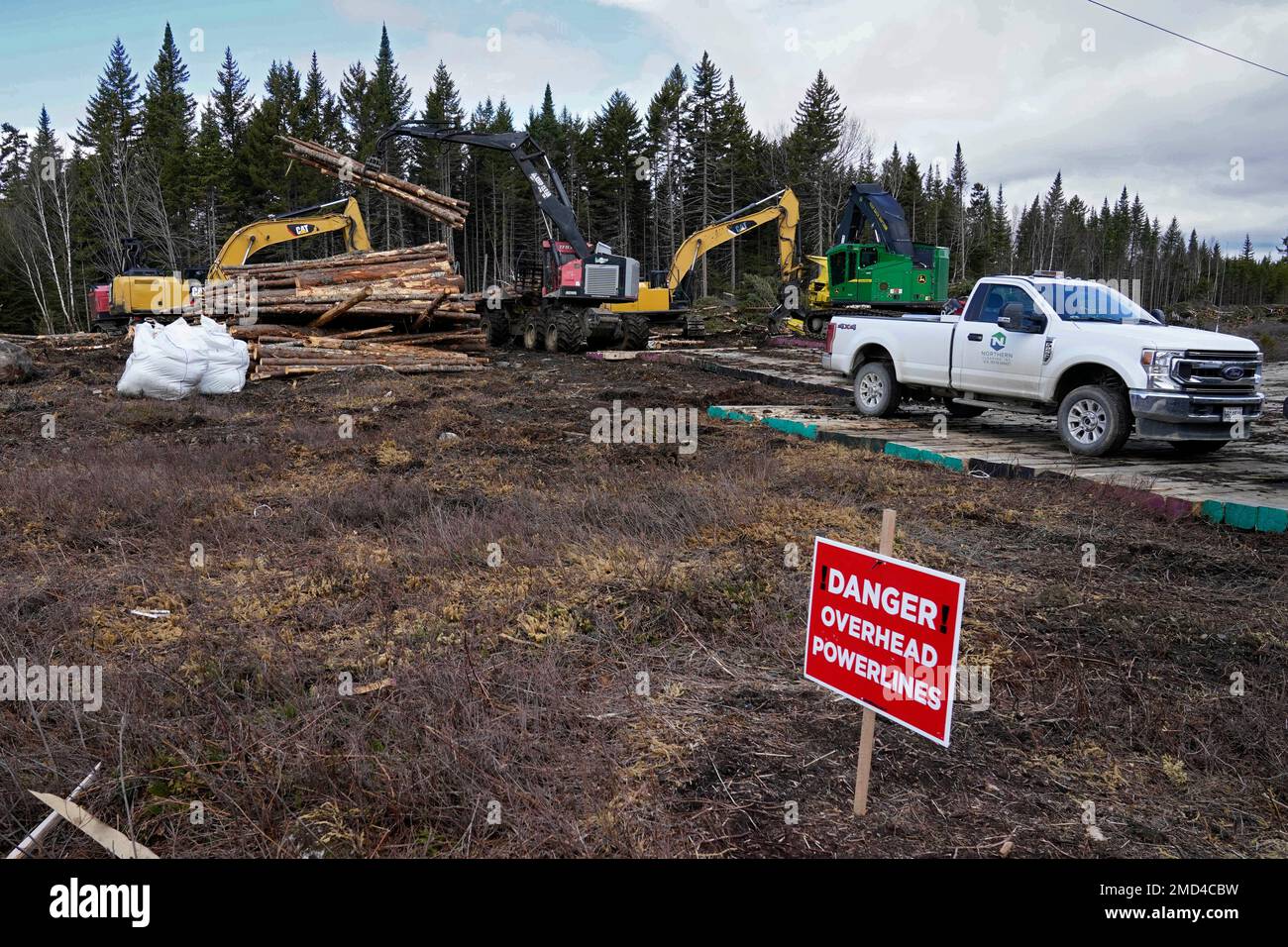 FILE - Workers for Northern Clearing remove trees on an existing ...