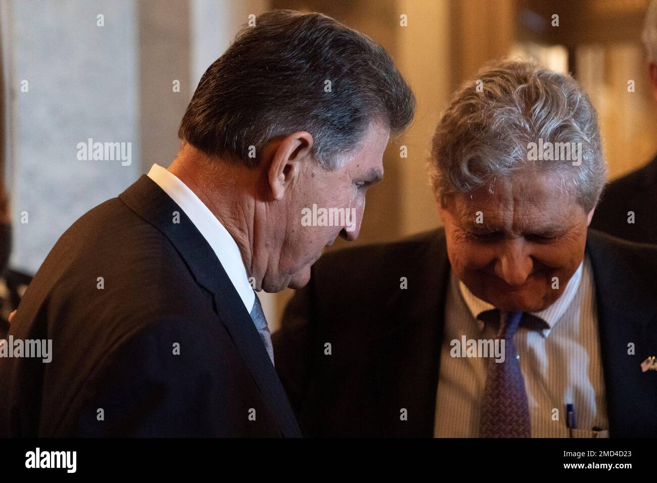 Sen. Joe Manchin, D-W.Va., left, speaks with Sen. John Kennedy, R-La ...
