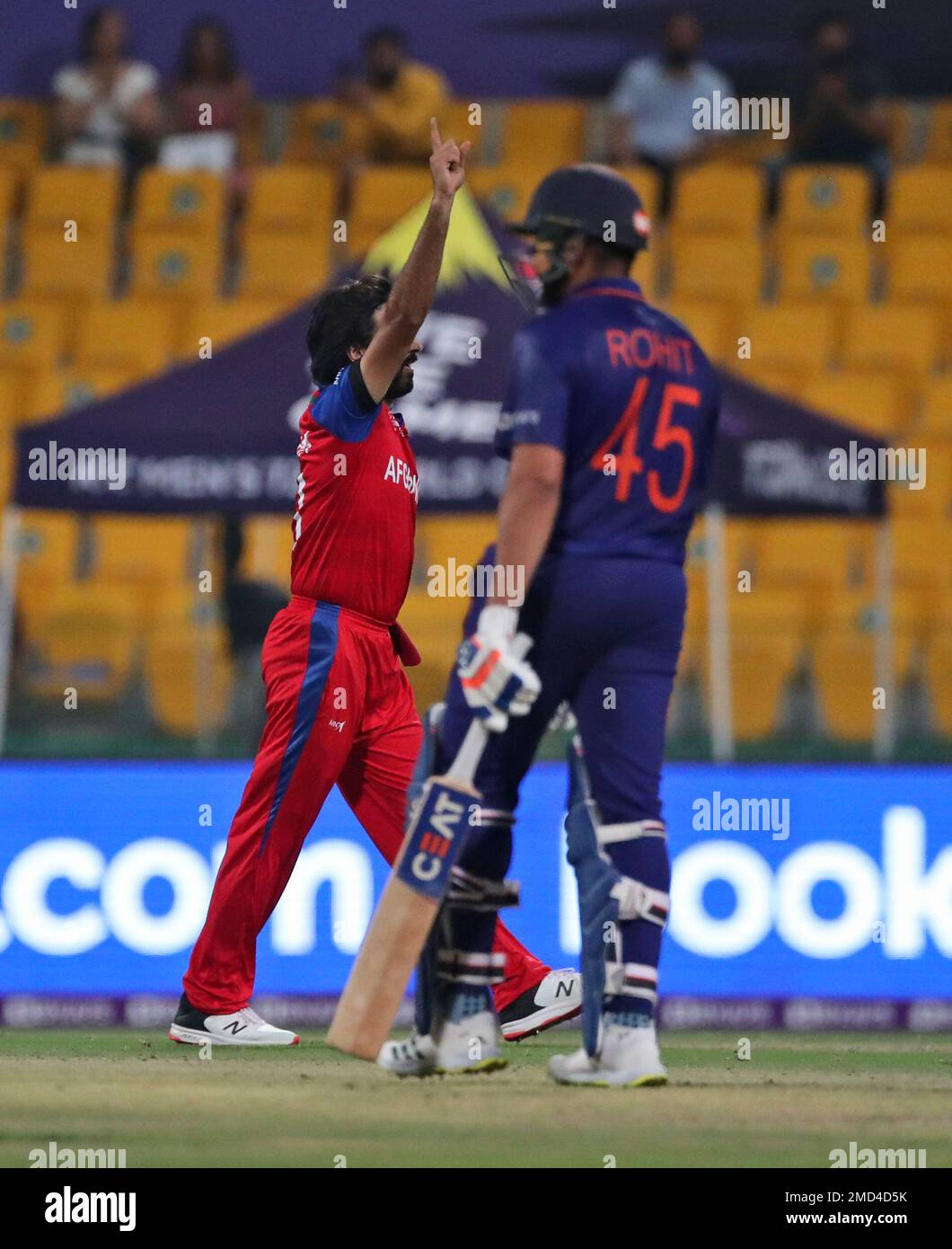 Afghanistan's Karim Janat celebrates the dismissal of India's Rohit ...