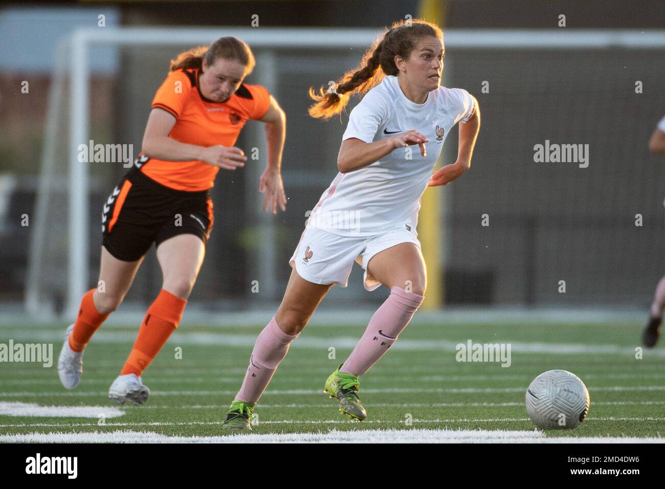 French center midfielder Rachel Corboz, right, pushes the ball upfield ...