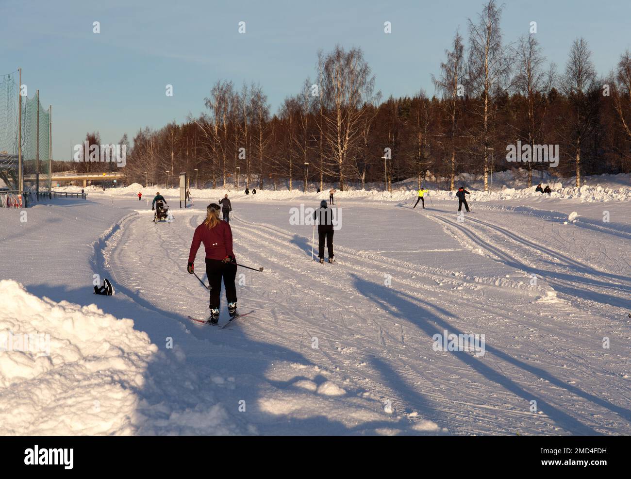 UMEÅ, SWEDEN ON JANUARY 21, 2023. Unidentified people enjoying weather ...