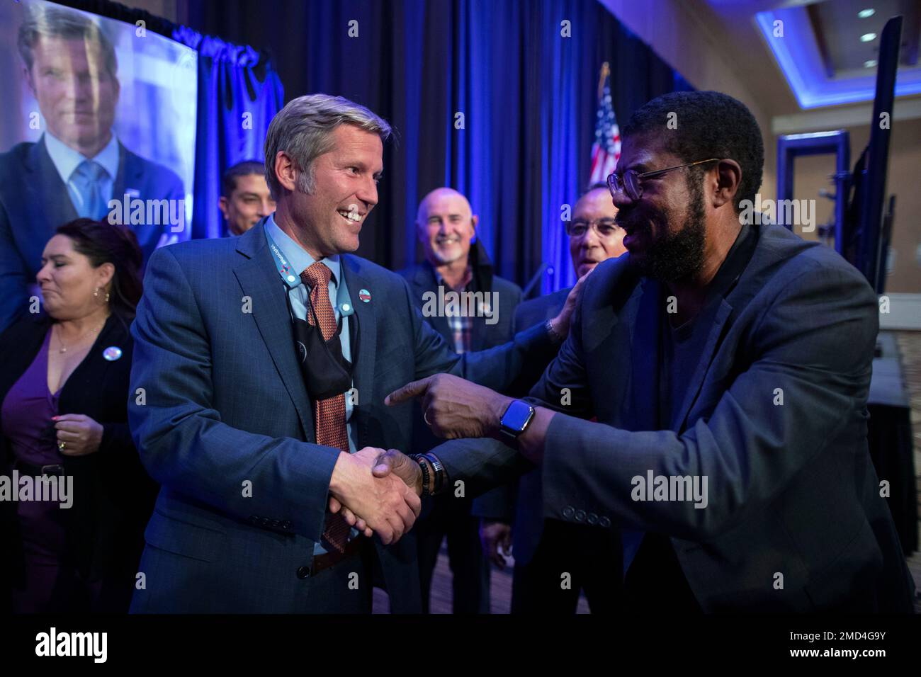 Albuquerque Mayor Tim Keller, left, shakes hands with a supporter after ...