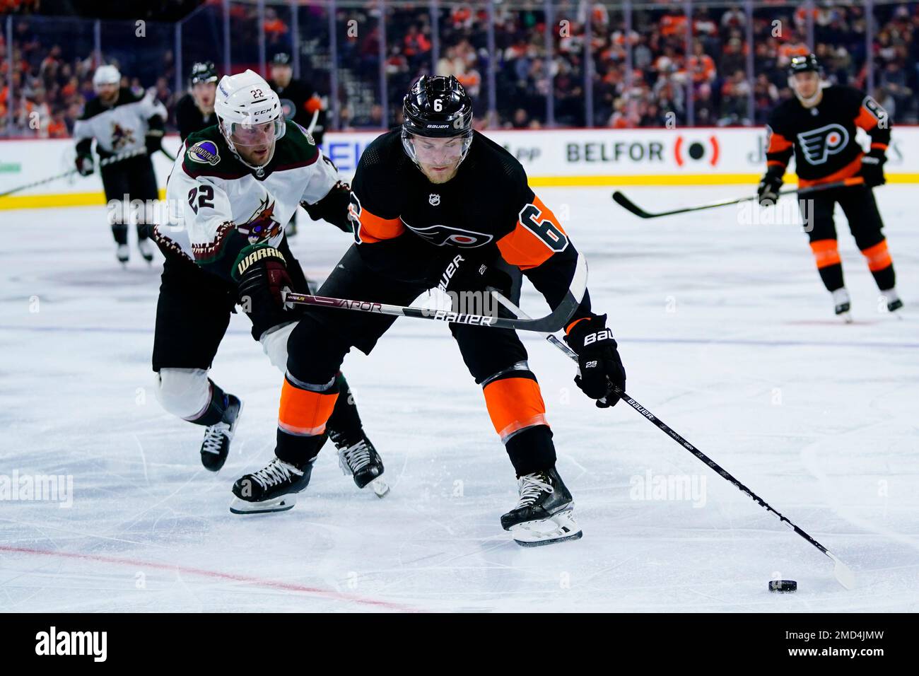 Philadelphia Flyers' Travis Sanheim (6) tries to keep the puck away ...
