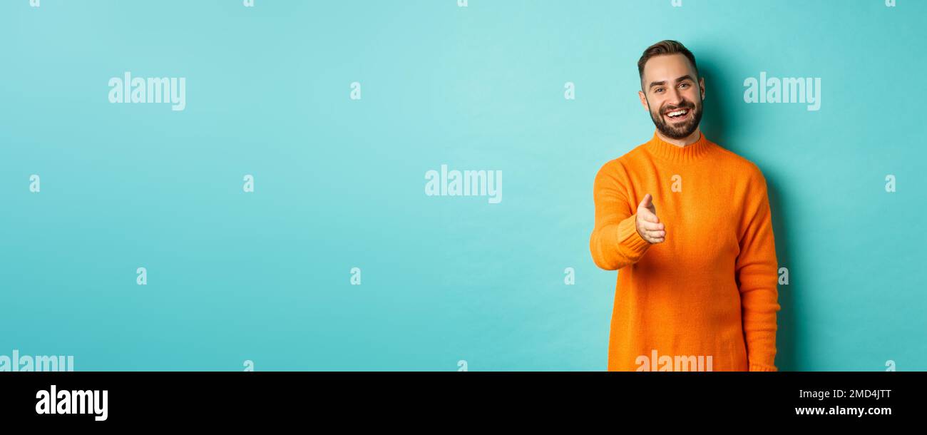 Friendly nice guy extend hand for handshake, greeting you and smiling ...