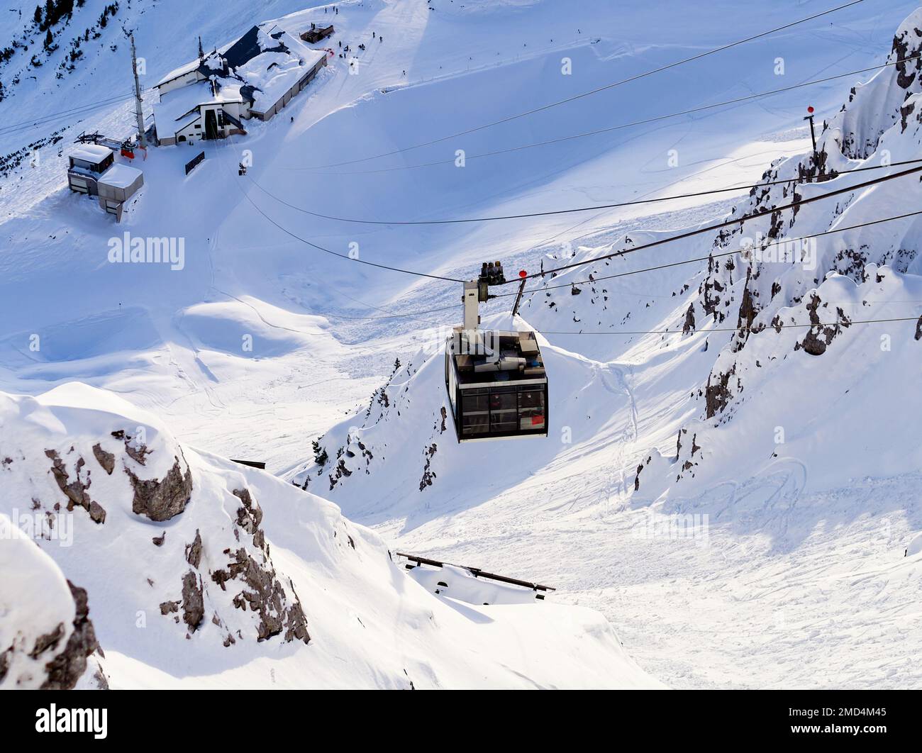 Cable car in alpine mountain Stock Photo - Alamy