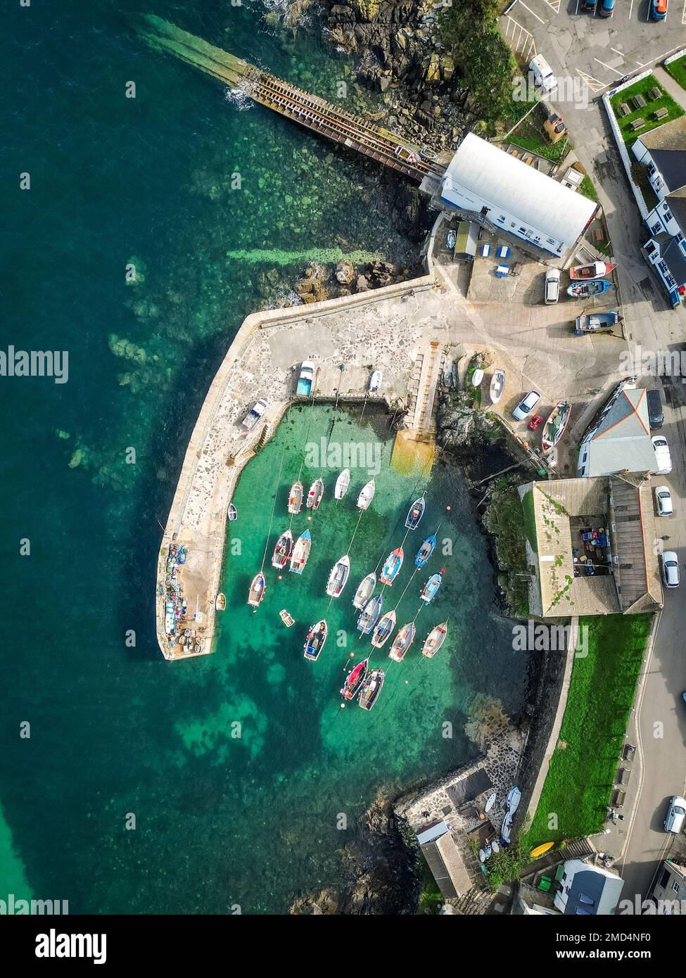 A vertical aerial shot of the port with parked ships and a crystal ...