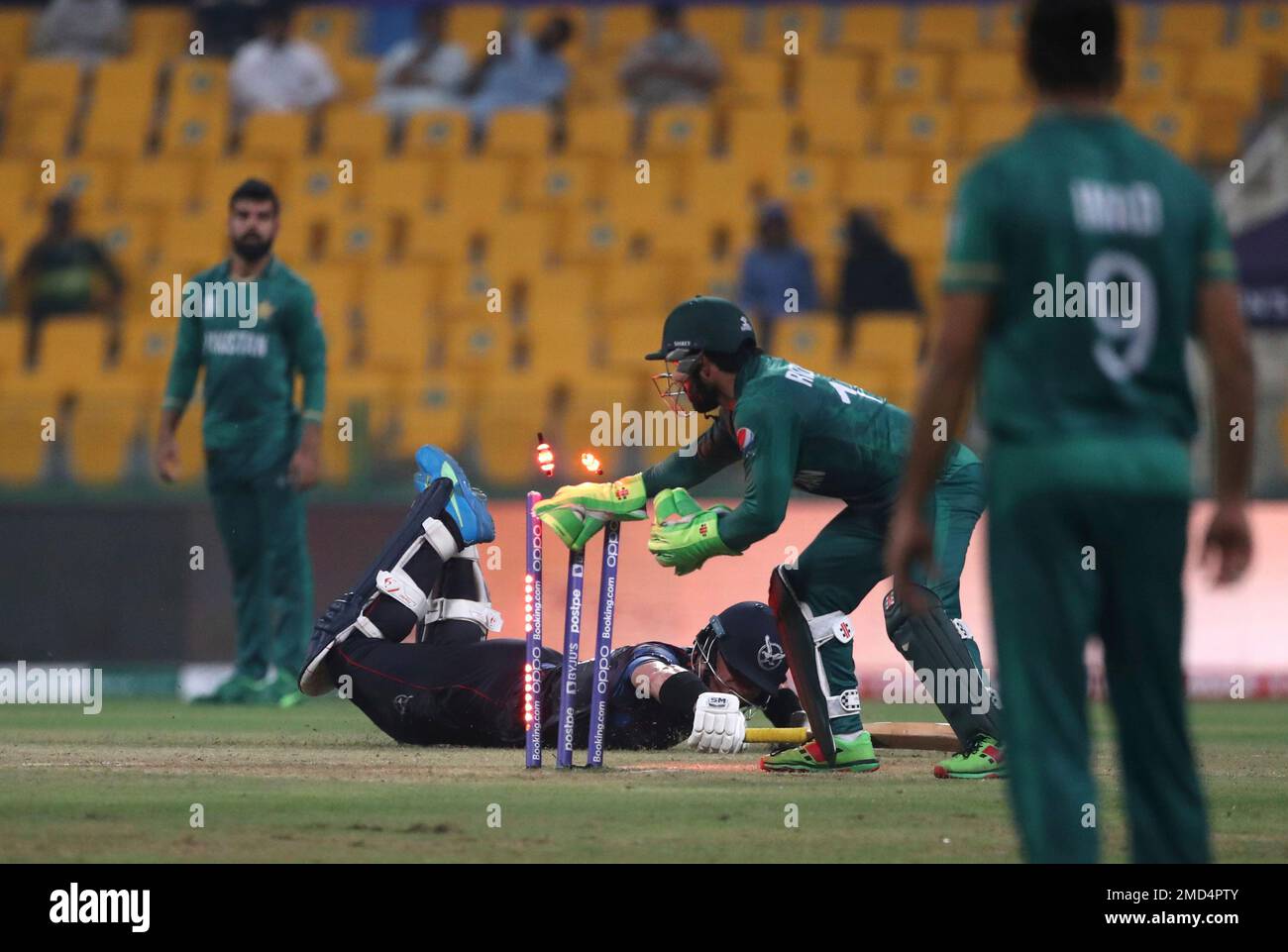 Pakistan's wicketkeeper Mohammad Rizwan, second right, runs out Namibia ...