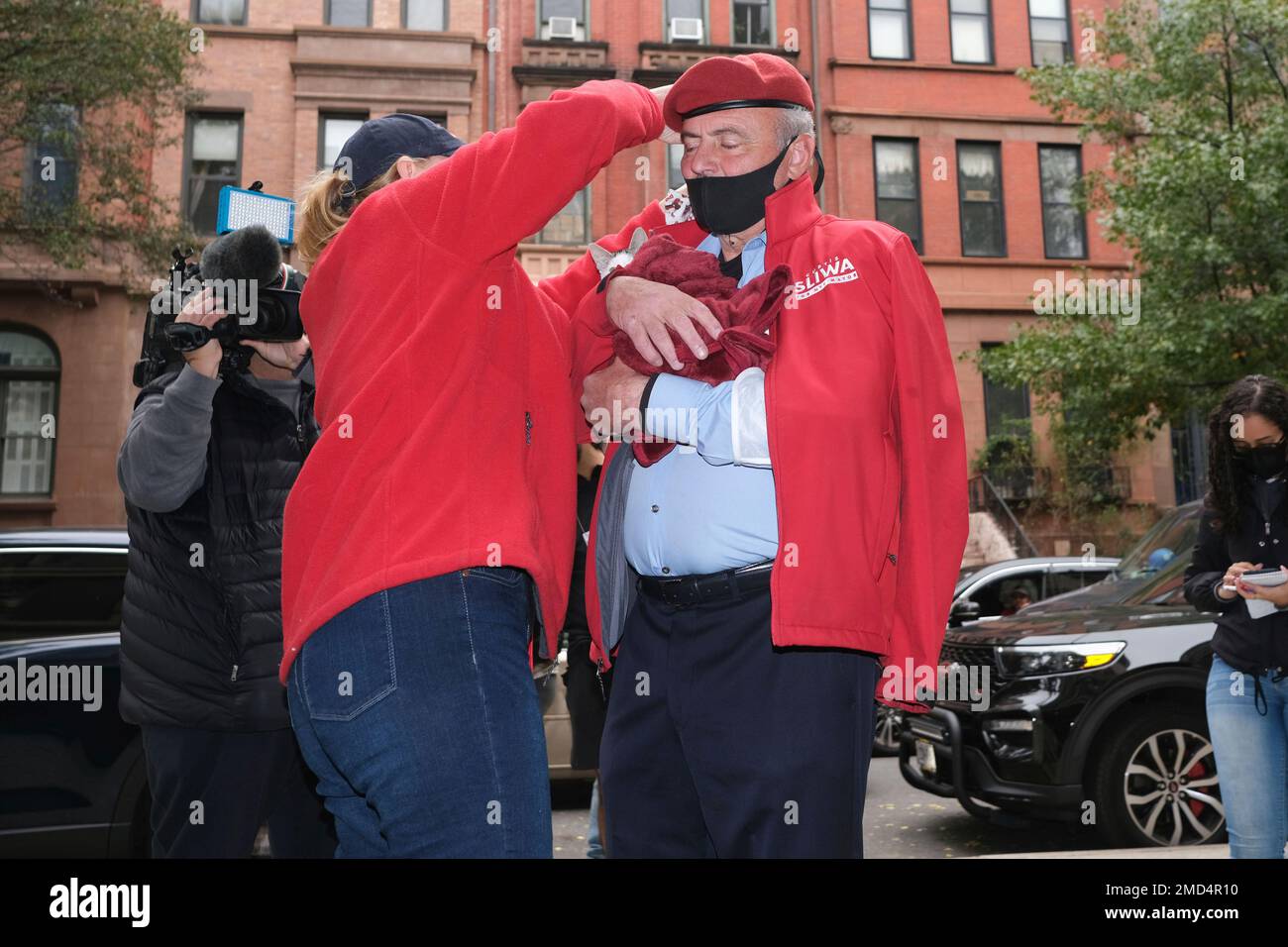 Mayoral candidate Curtis Sliwa's wife, Nancy Regula, helps Sliwa get ...