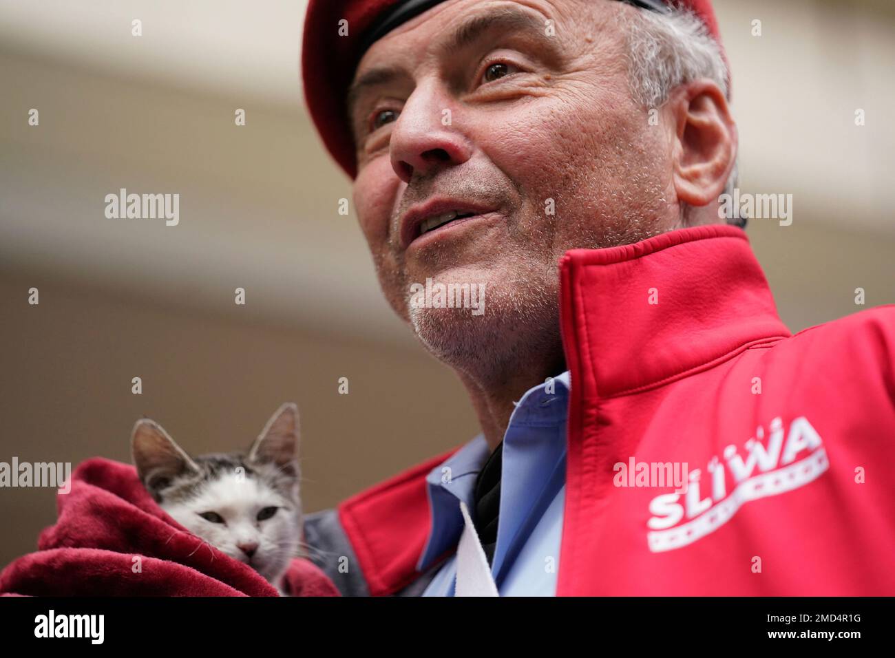 Mayoral candidate Curtis Sliwa talks to reporters with a rescue cat ...