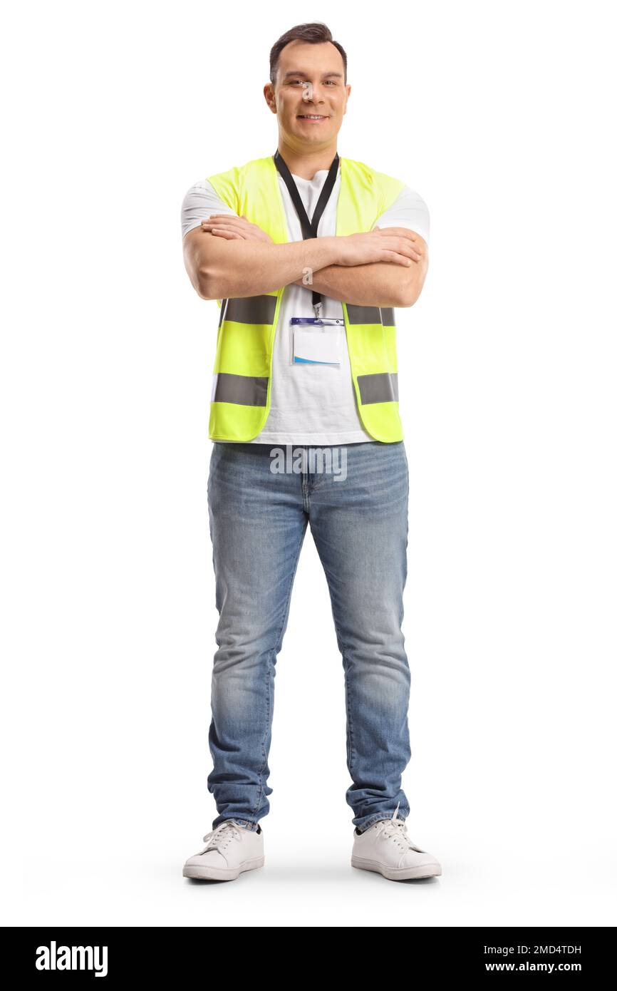 Full length portrait of a security guard in a safety vest standing with ...