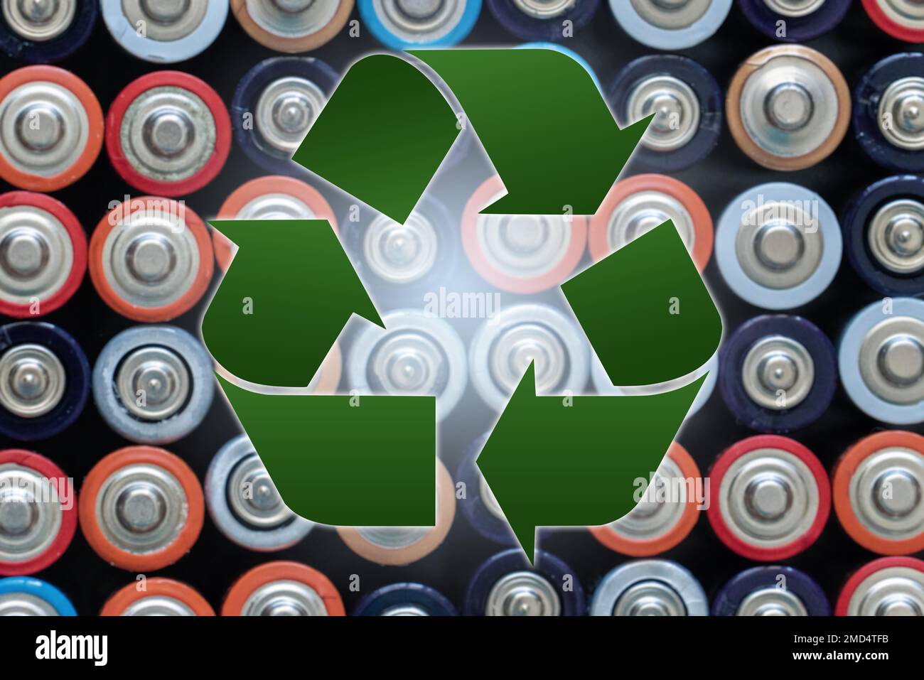 Recycling symbol on a background of used AA battery Stock Photo - Alamy