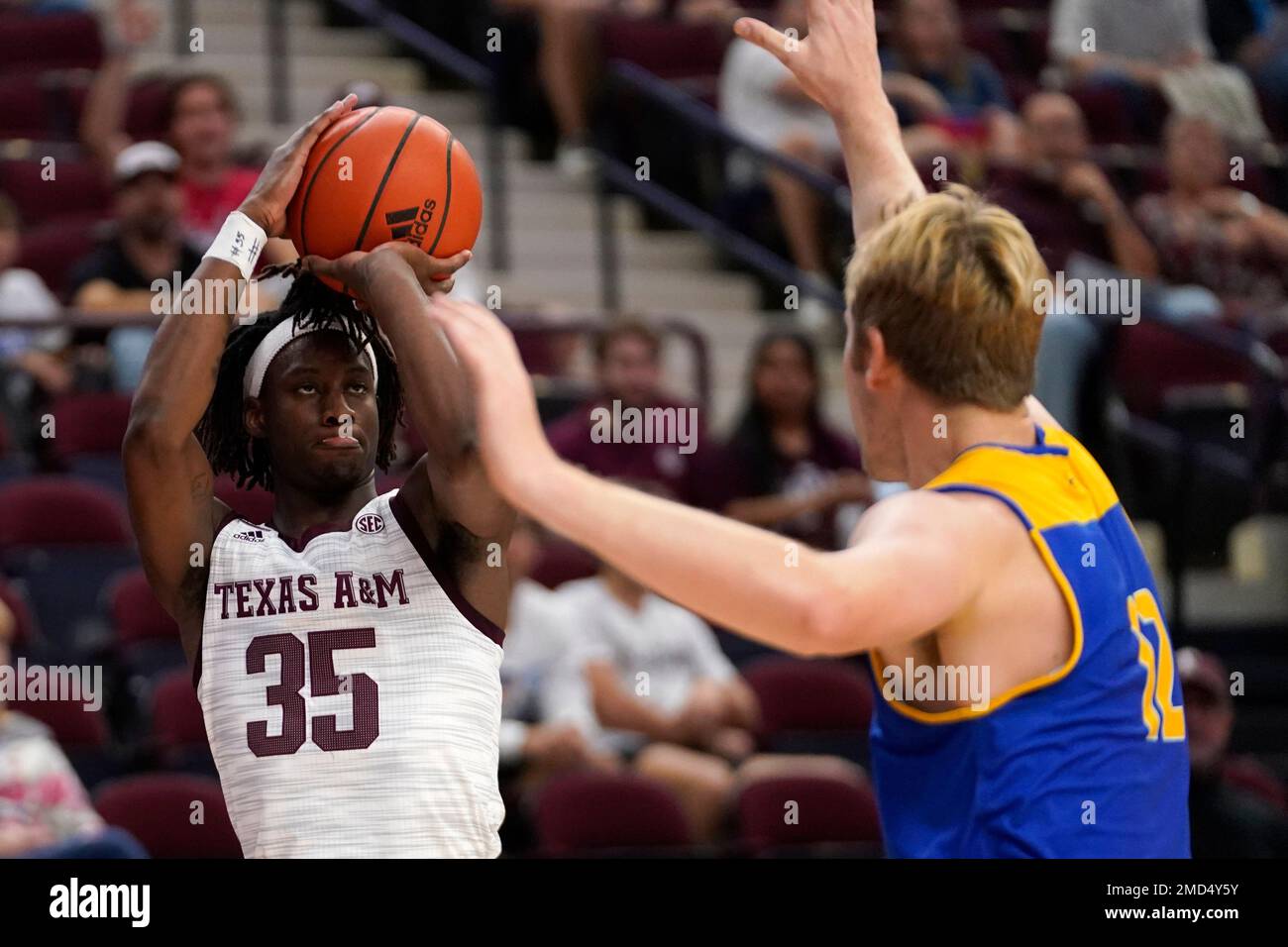 Texas A&M guard Manny Obaseki (35) shoots over Texas A&M Kingsville ...