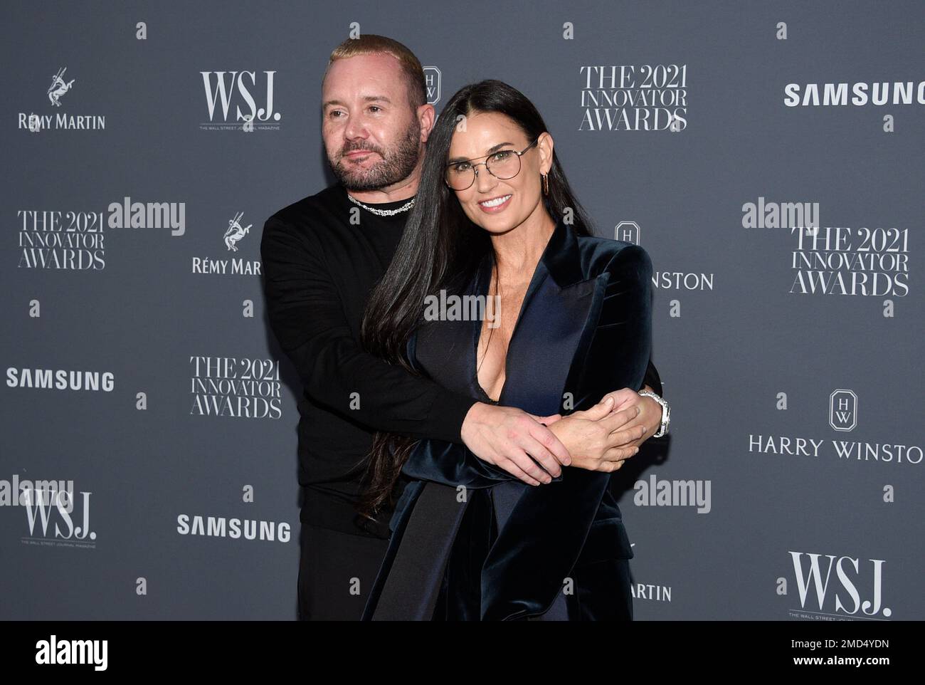 Designer Kim Jones, left, and Demi Moore attend the WSJ. Magazine ...