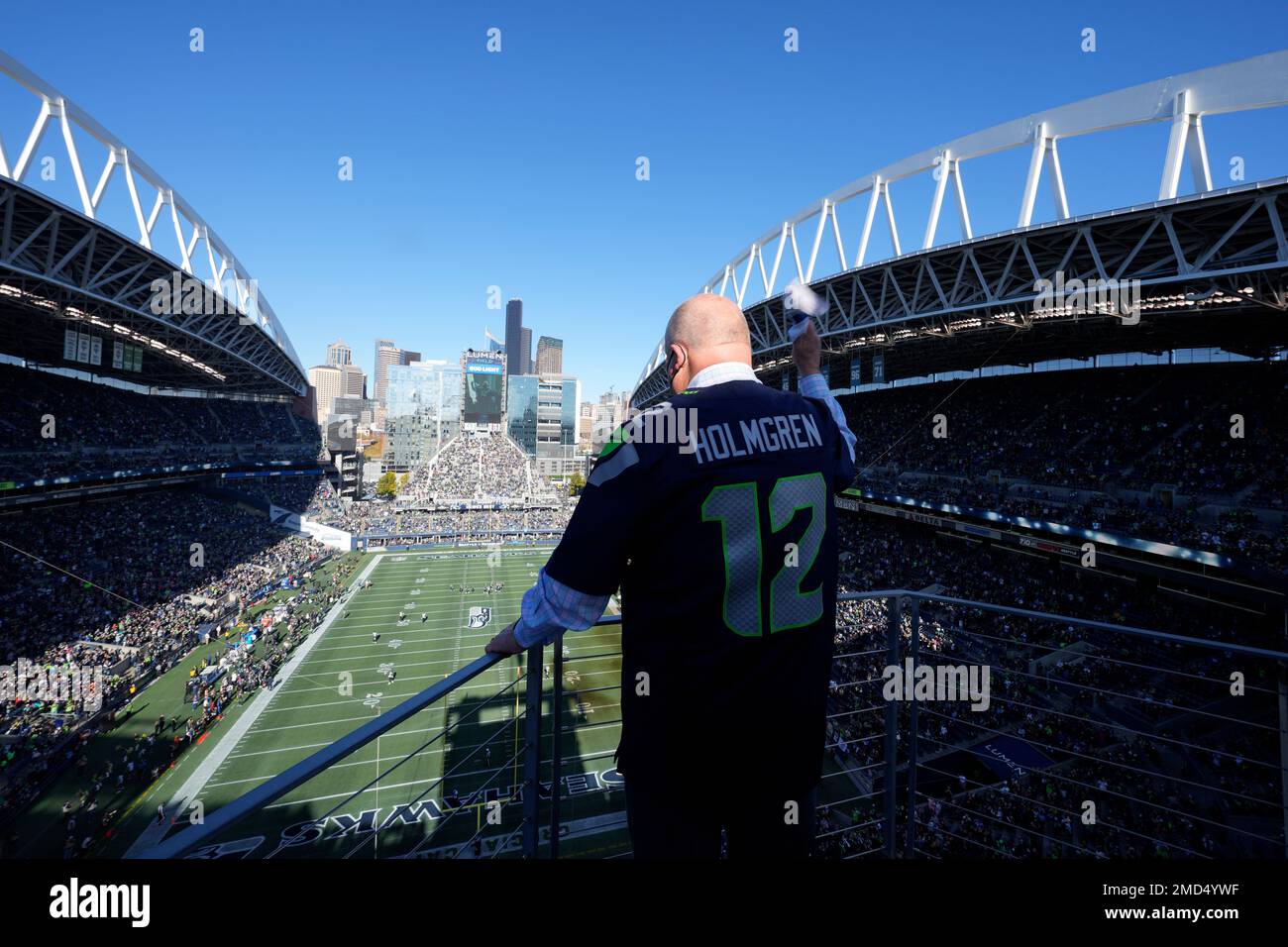 Mike Holmgren raises the 12th man flag during a Seattle Seahawks NFL ...