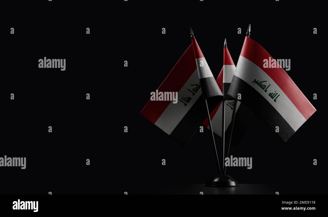 Small national flags of the Iraq on a black background Stock Photo - Alamy