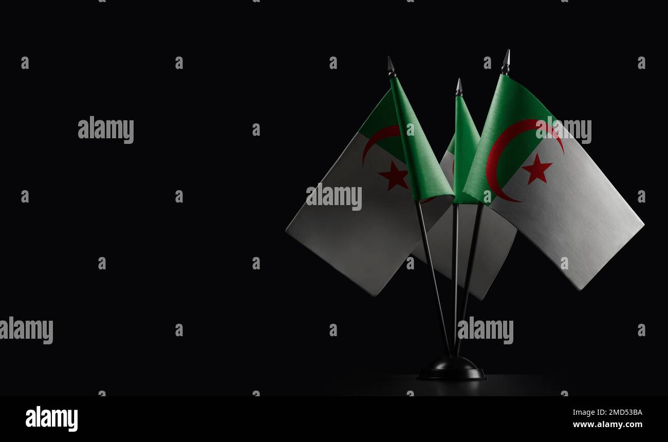 Small national flags of the Algeria on a black background Stock Photo ...