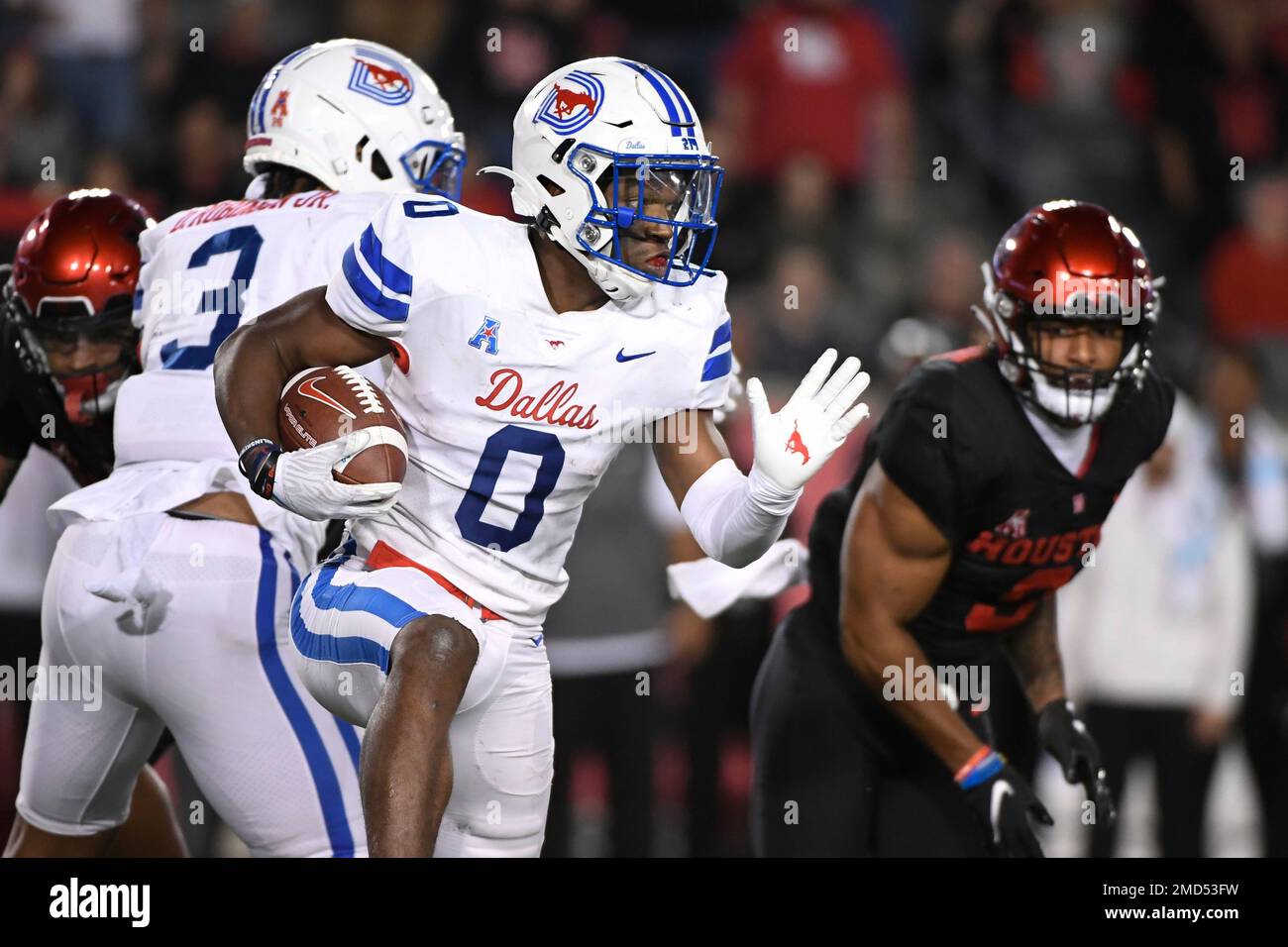SMU cornerback Bryan Massey (0) runs a kick against Houston during the ...