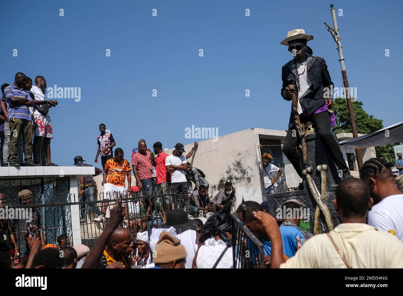People believed to be possessed with the Gede spirit hold a ceremony ...