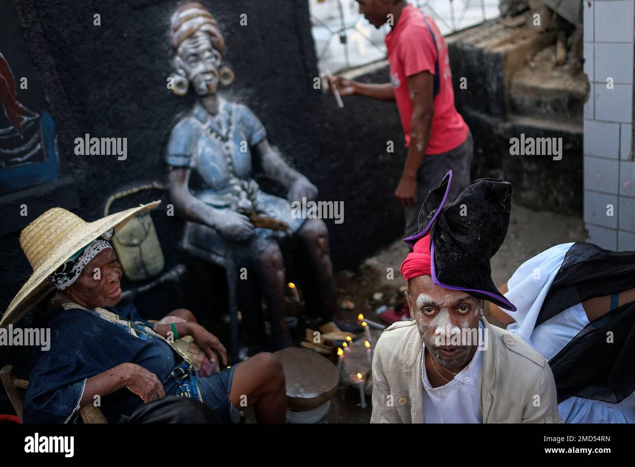 People believed to be possessed with the Gede spirit hold a ceremony ...