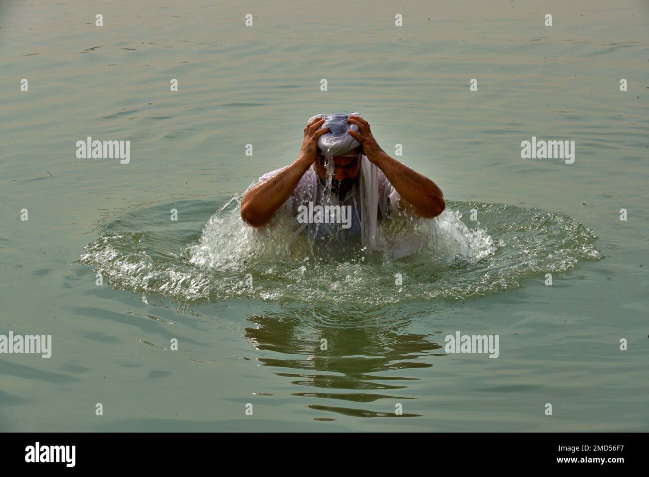 An Iraqi Sabean Mandaean stands in the Tigris River during the ...