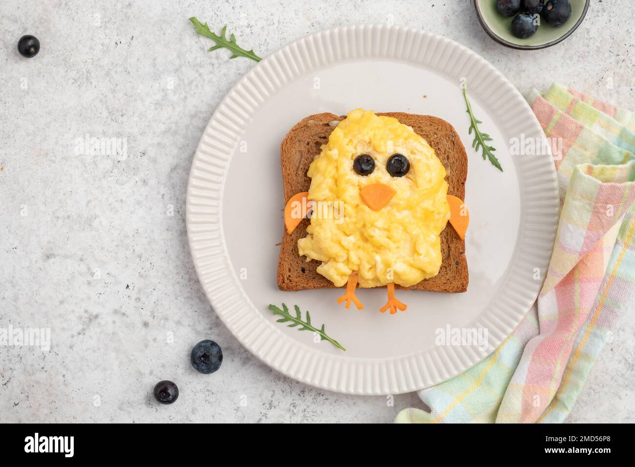 Funny toast with scrambled eggs in a shape of chicken Stock Photo - Alamy