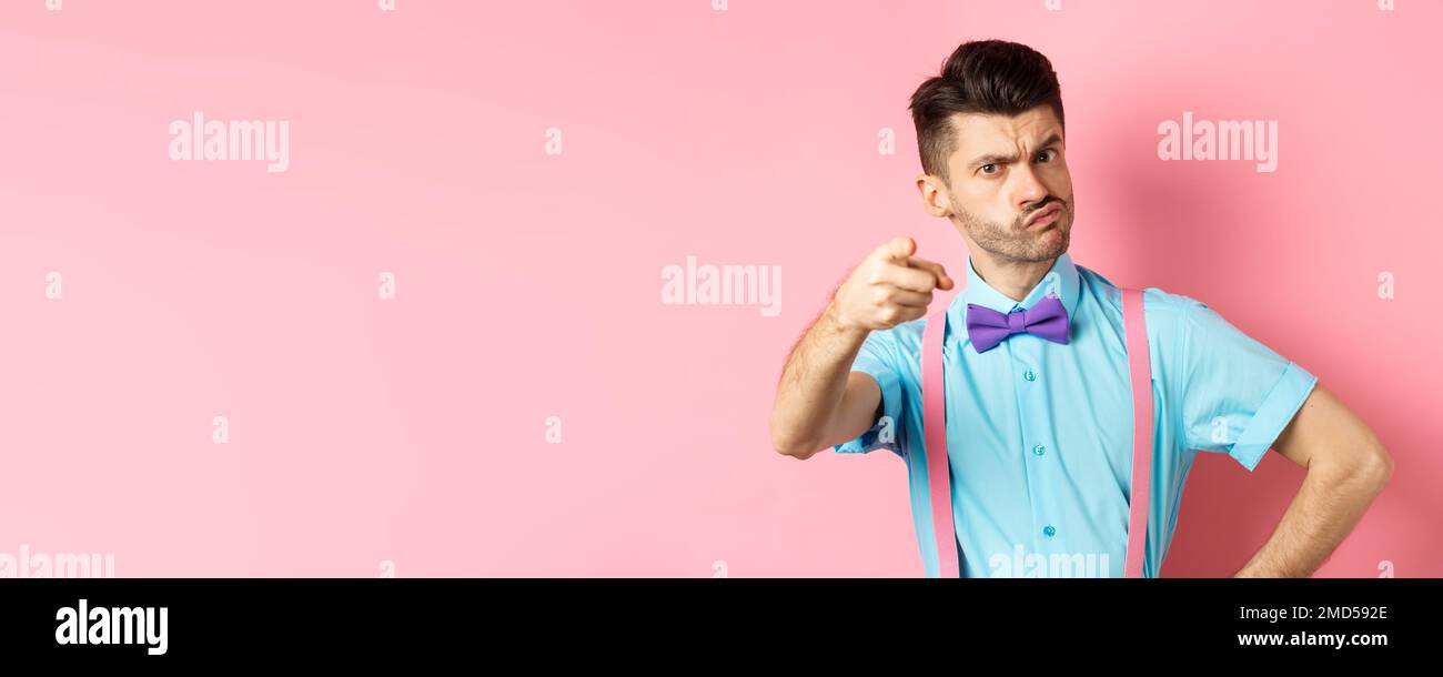 Grumpy guy in bow-tie and suspenders accusing you, its your fault ...