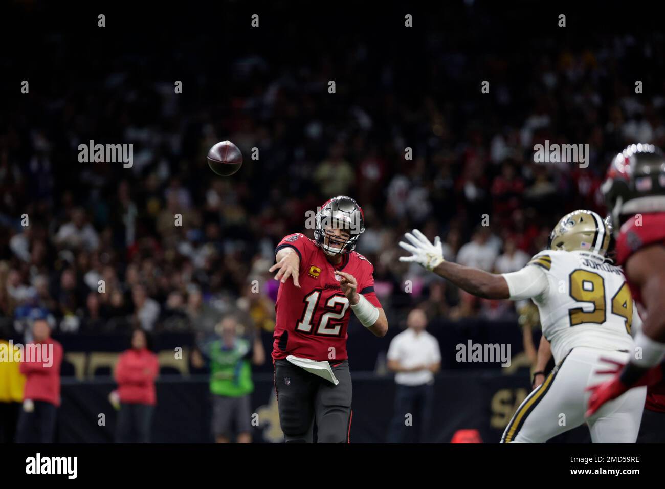 Tampa Bay Buccaneers quarterback Tom Brady (12) passes under pressure ...