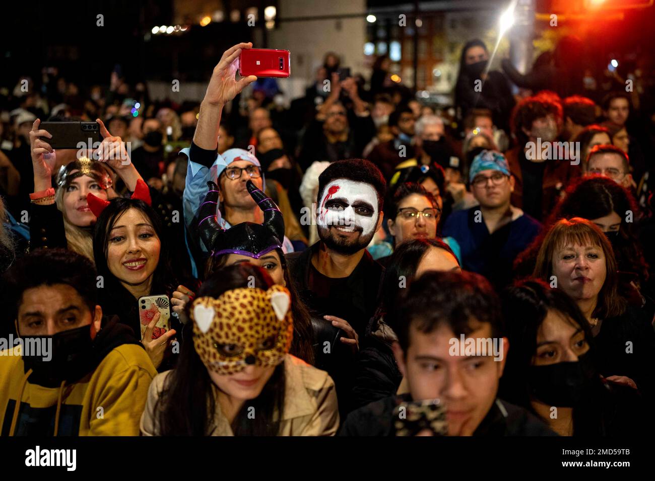 People watch Halloween revelers march in New York City's 48th annual ...