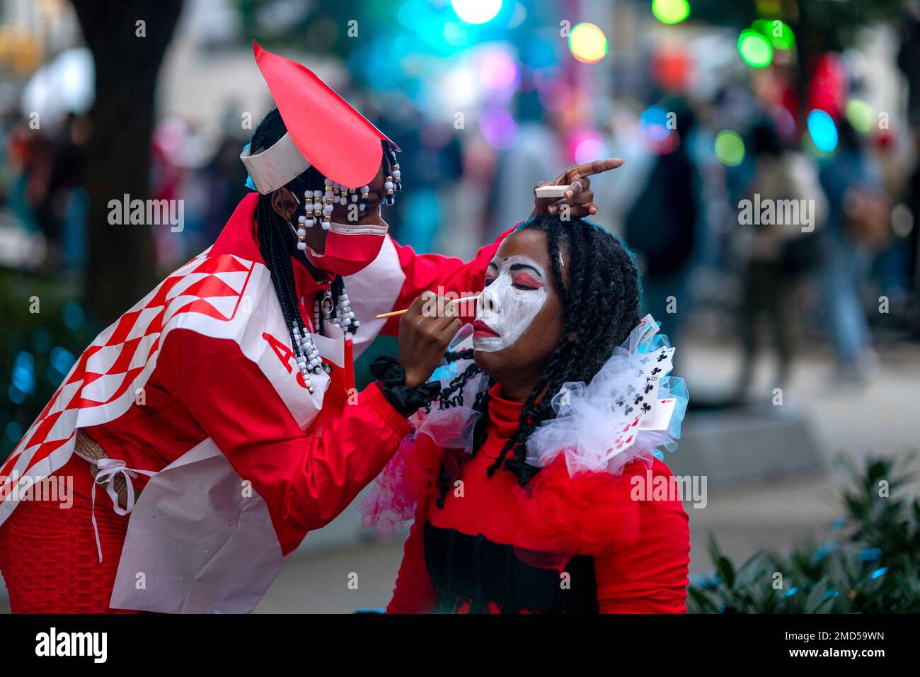 A reveler gets her makeup done before the start of New York City's 48th ...