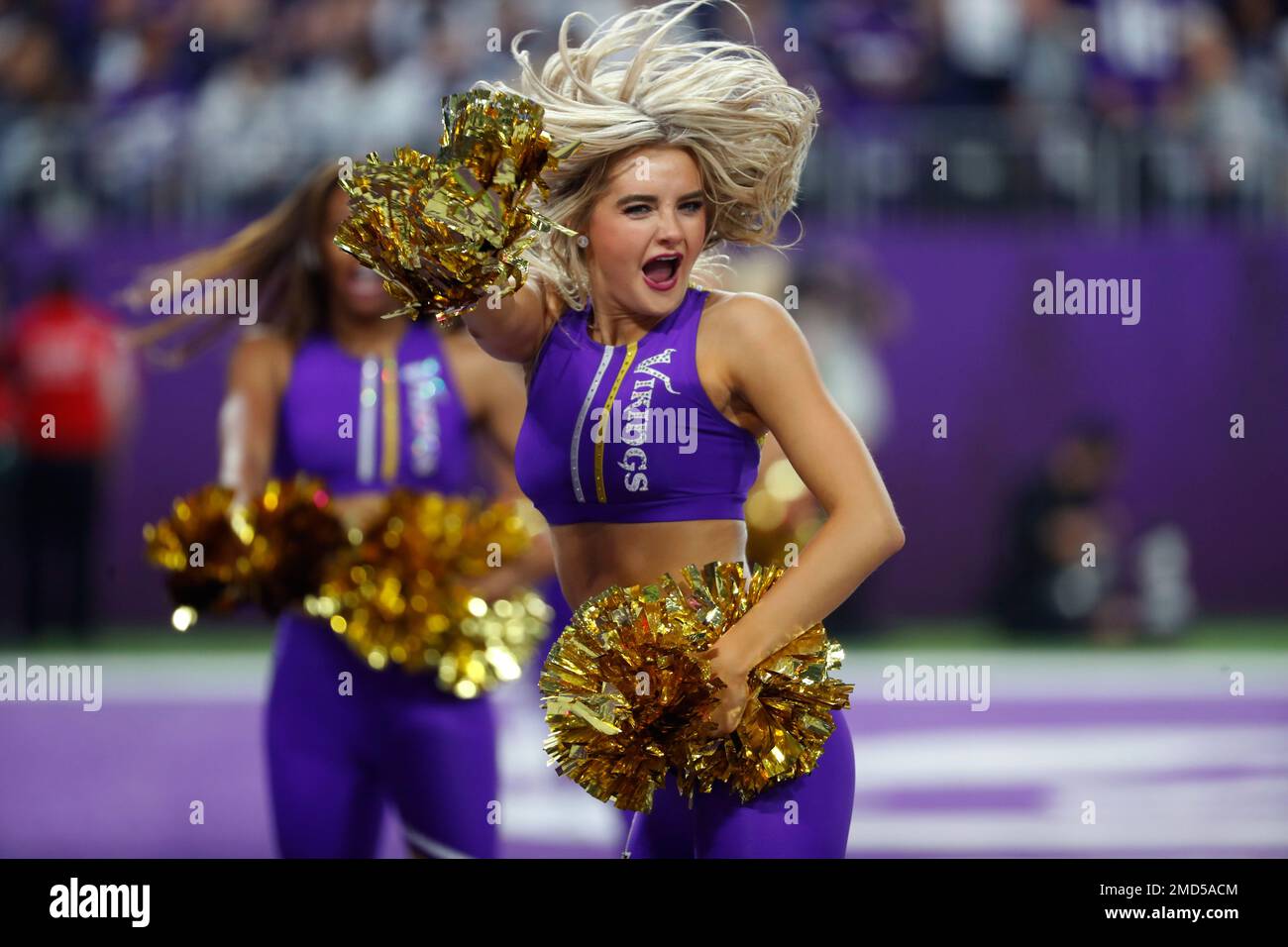 A Minnesota Vikings cheerleader performs during the first half of an ...