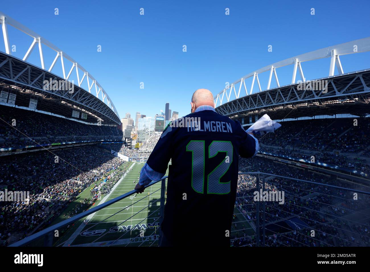 Mike Holmgren raises the 12th man flag during a Seattle Seahawks NFL ...