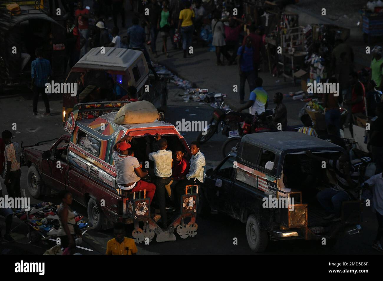Commuters ride a public transportation vehicle known as a Tap-tap in ...