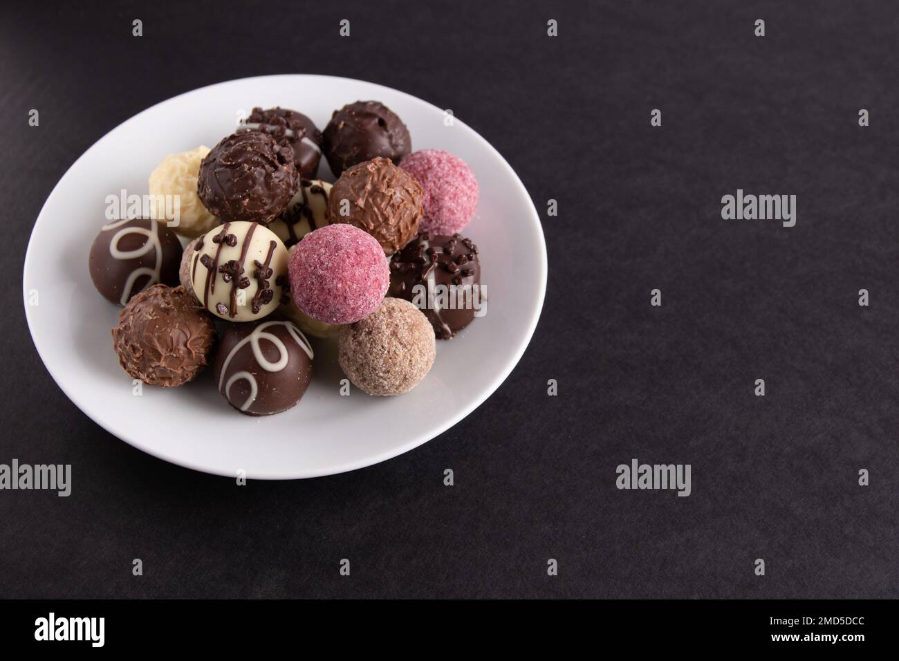 photo of a lot of chocolates lying in a plate Stock Photo - Alamy