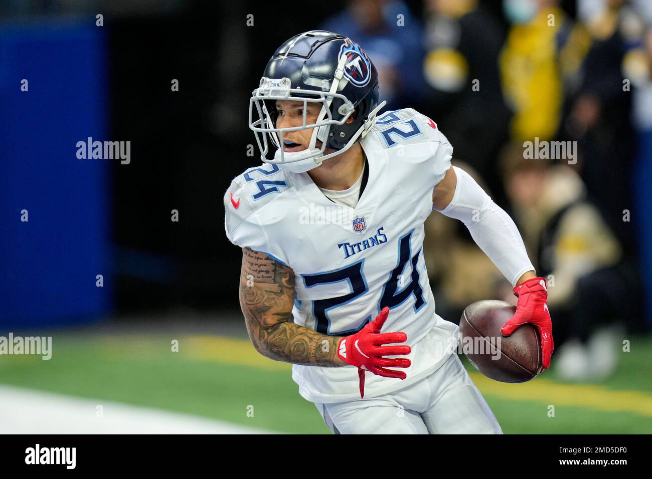 Tennessee Titans cornerback Elijah Molden (24) scores a touchdown on an ...