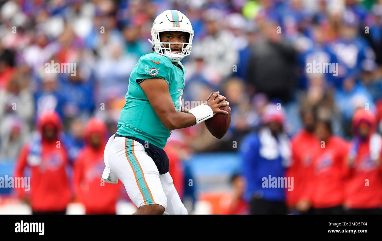 Miami Dolphins quarterback Tua Tagovailoa, right, looks to pass during ...
