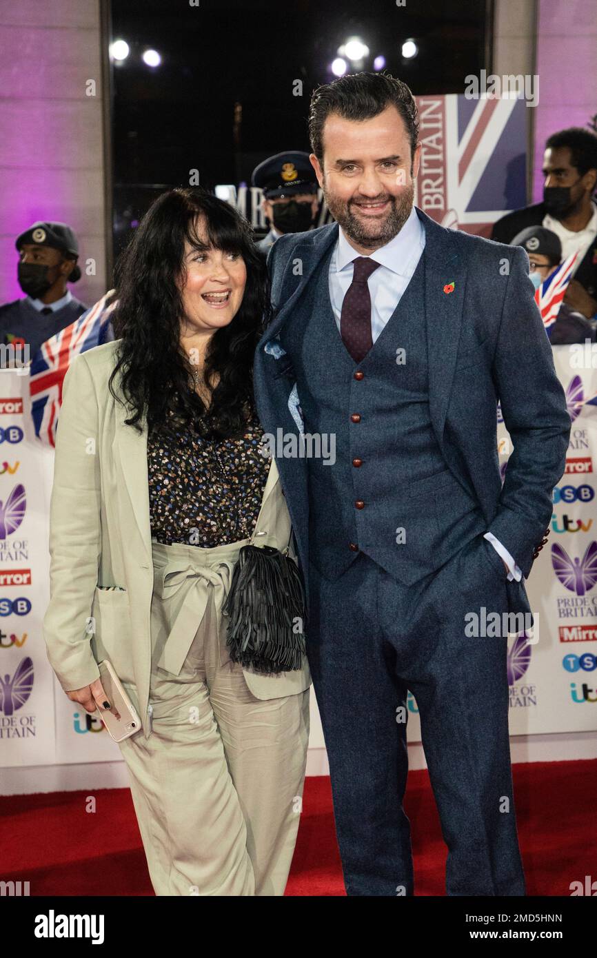 Daniel Mays, right, and Louise Burton pose for photographers upon ...