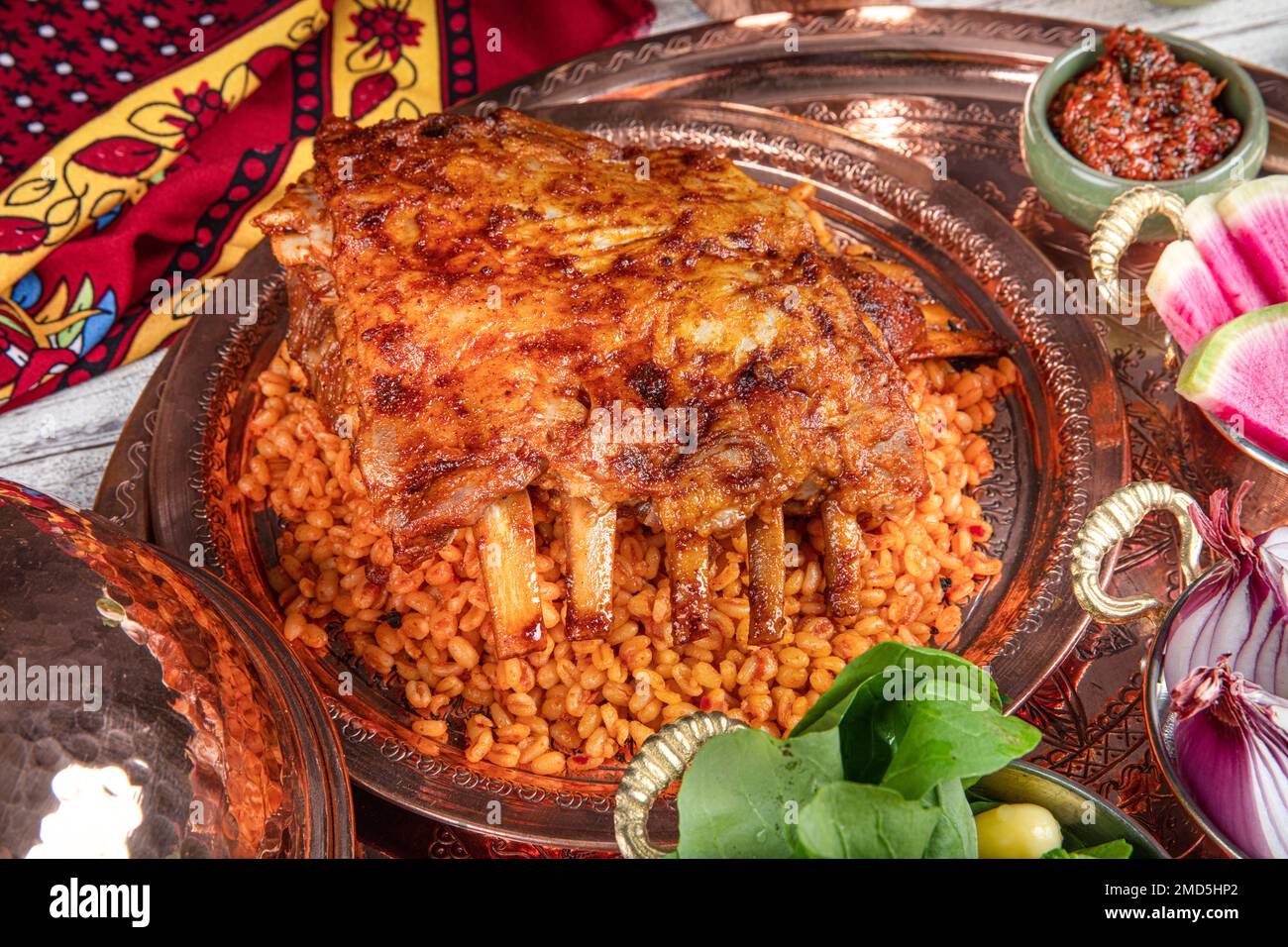 Lamb ribs on bulgur pilaf. Stuffed Ribs isolated on black background ...